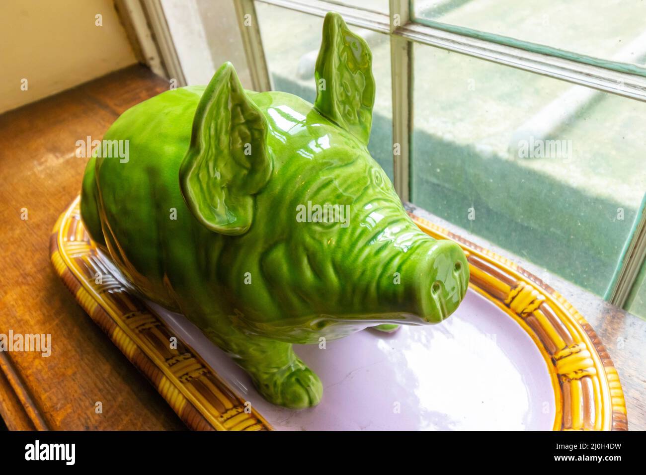 green ceramic pottery pig at Calke Abbey Derbyshire Stock Photo - Alamy