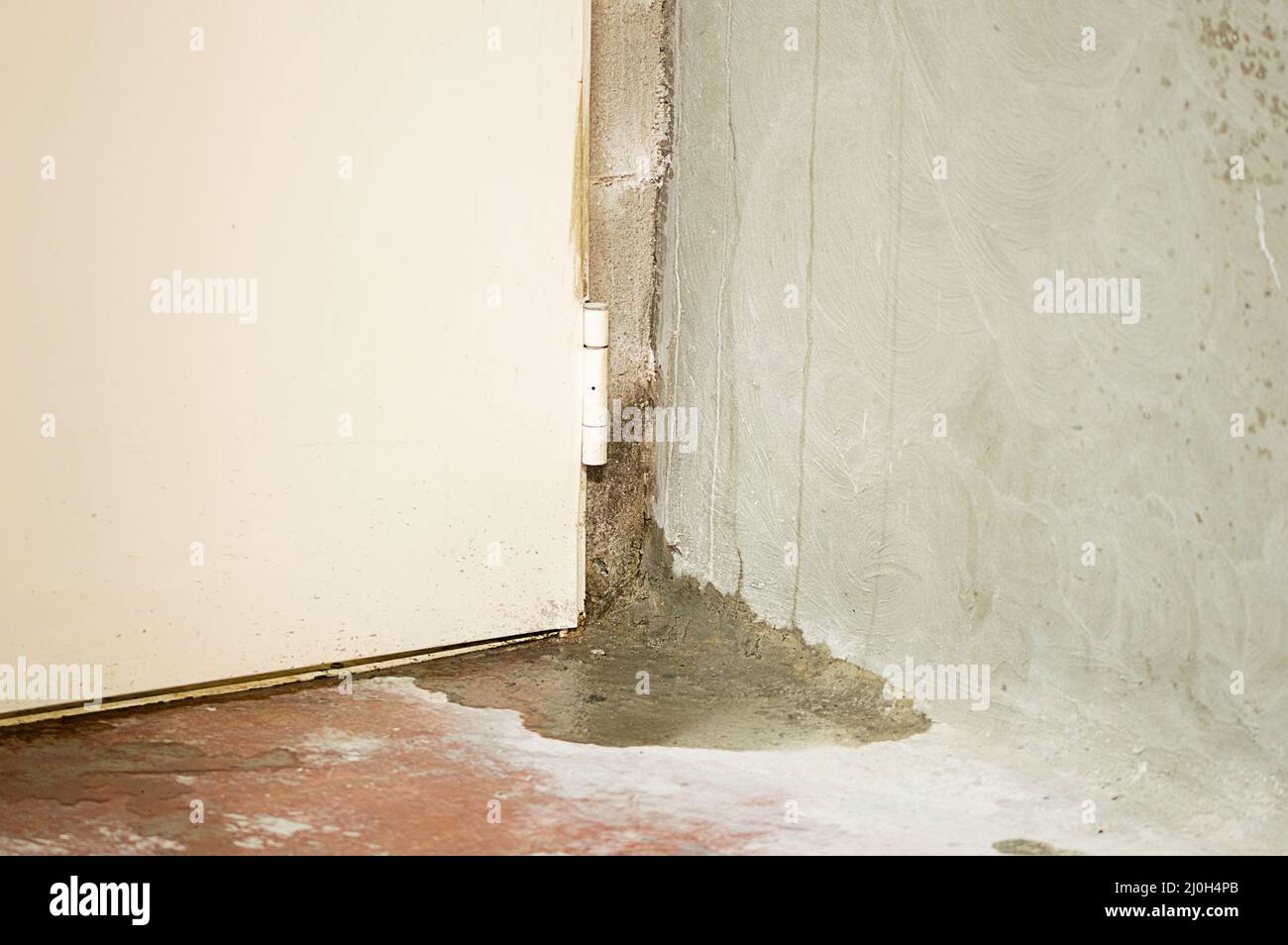Detail of an entrance door with water filtering inside Stock Photo - Alamy