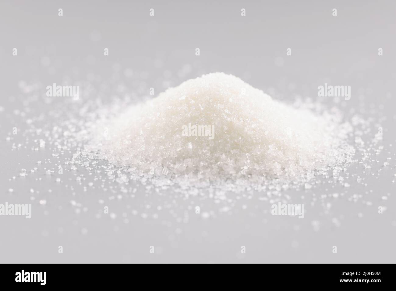 Sugar crystals pile on grey background, heap of sweet powder, sugar ...