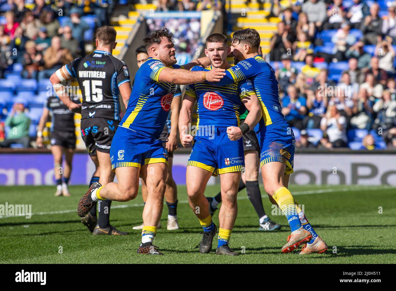 Danny Walker #16 of Warrington Wolves celebrates his try Stock Photo ...