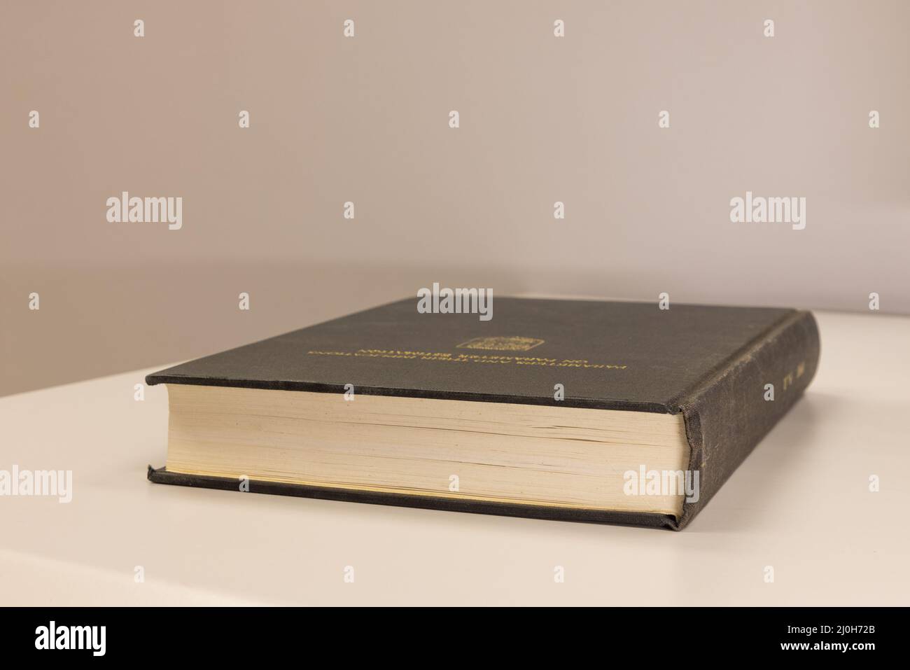 a PhD thesis of dark grey cover on desk Stock Photo - Alamy