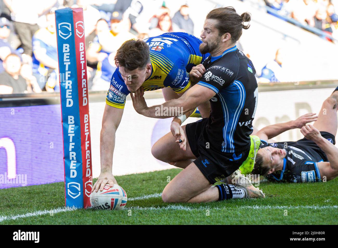 Josh Thewlis #22 of Warrington Wolves goes over for a try in, on 3/19 ...