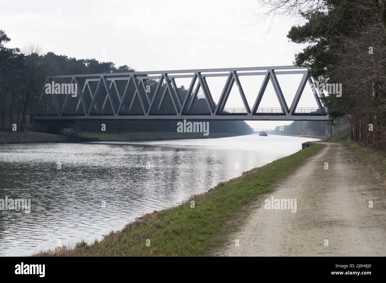Canal with a bridge on a windy day Stock Photo - Alamy