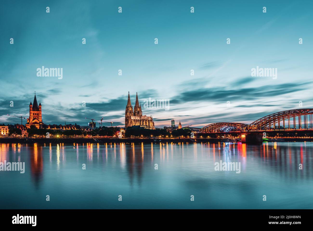 Panoramic view of Cologne Cathedral with Hohenzollern Bridge at ...