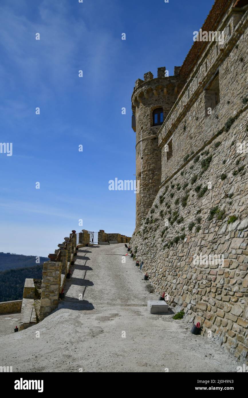 Narrow pathway leading to the ancient fortress in Rocca Cilento against ...
