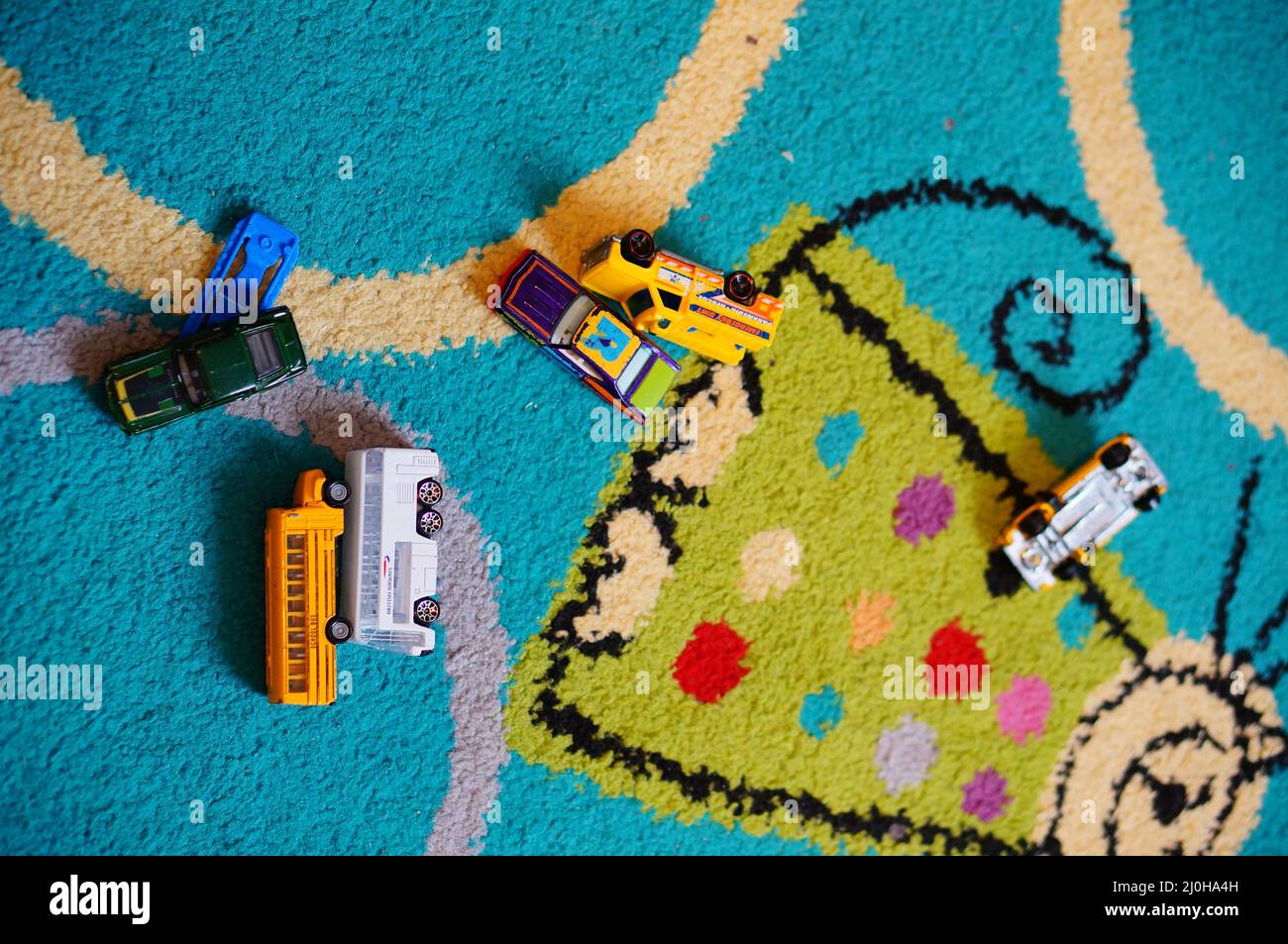 Vertical shot of a mix of Mattel Wheels toy model cars on a floor Stock ...