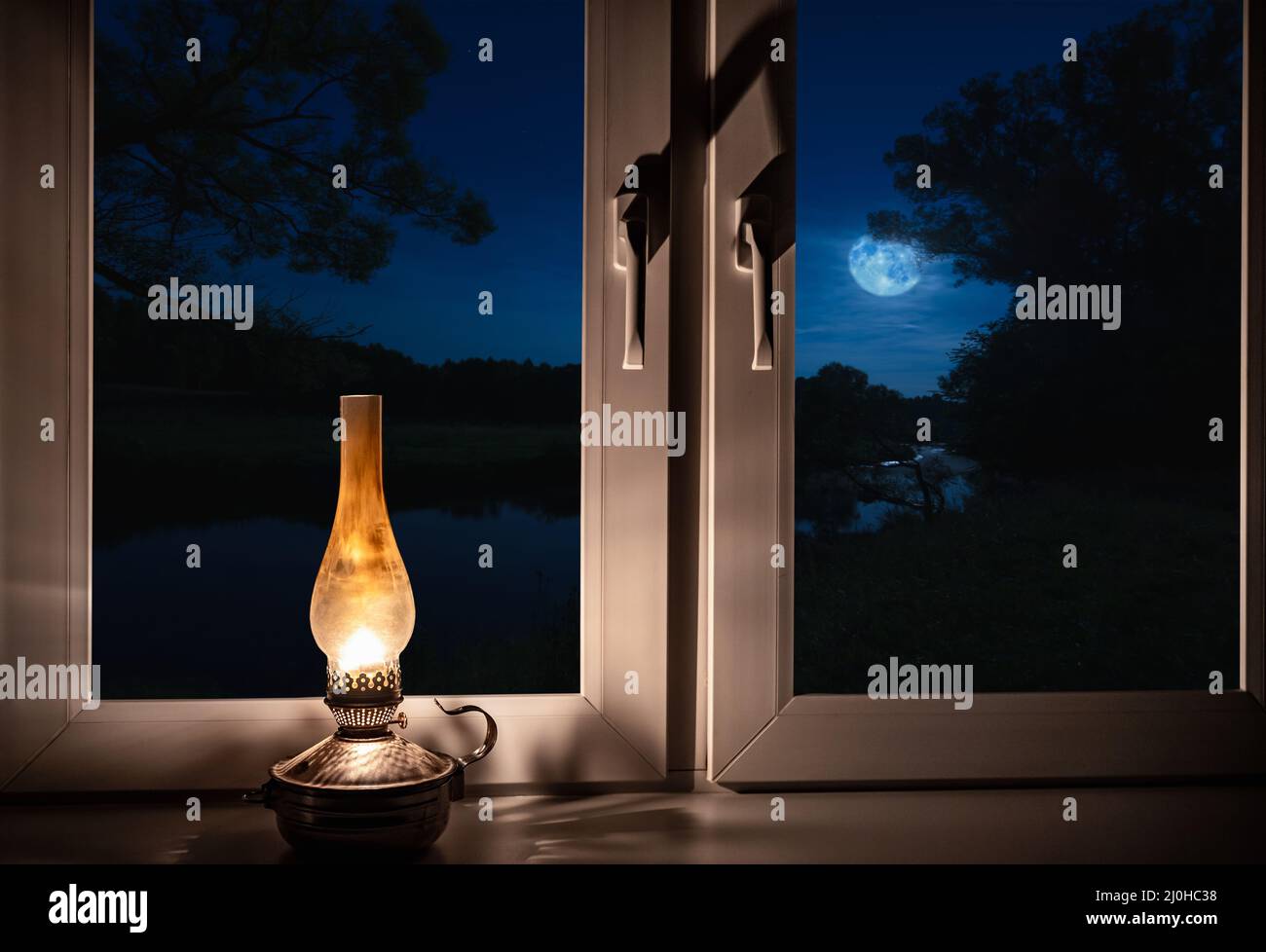 Night landscape outside the window moon old lamp windowsill Stock Photo ...