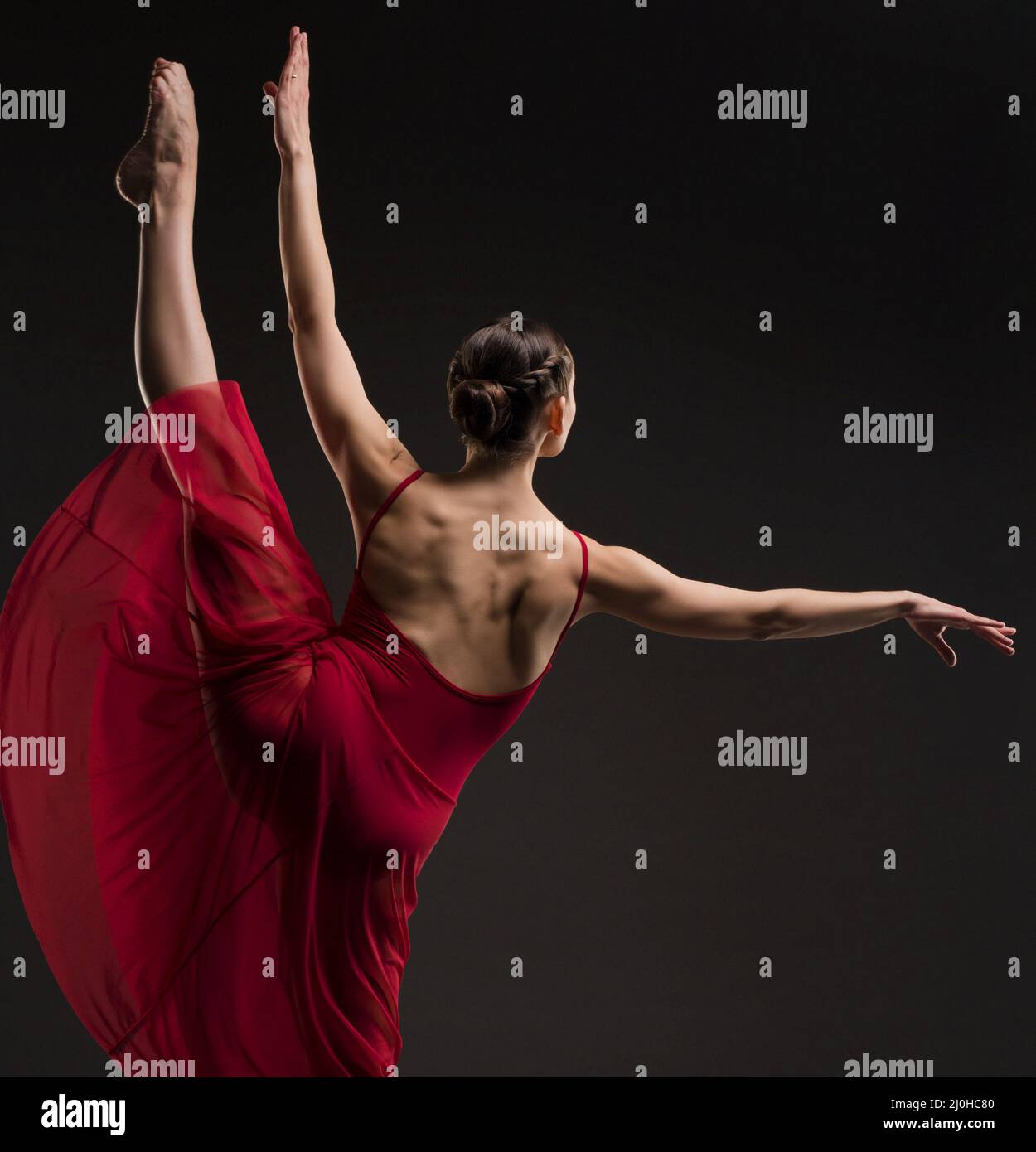 Beautiful girl dancing gracefully rearview Stock Photo - Alamy