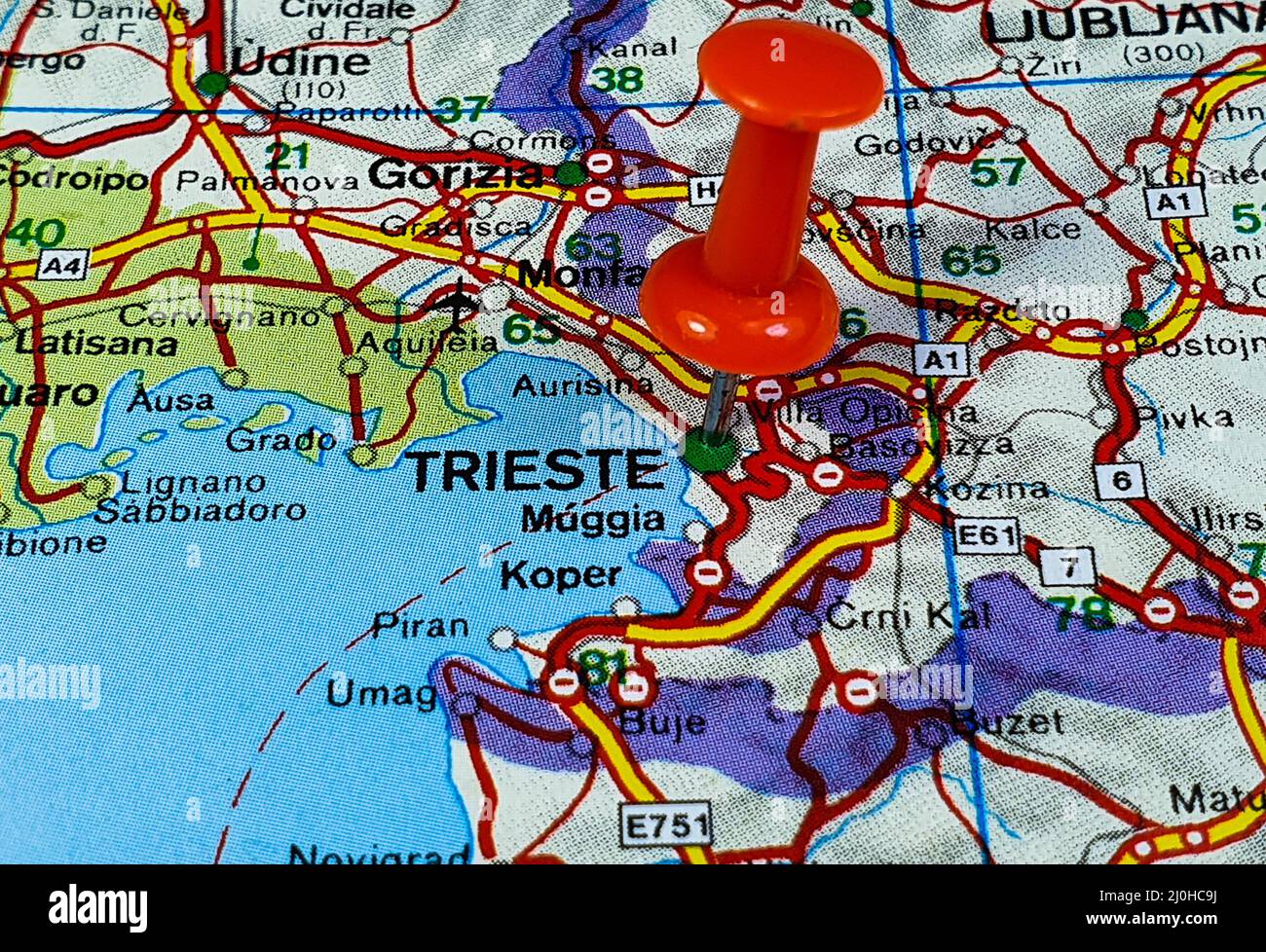 Closeup shot of a red mark on location on the map of Trieste city in ...
