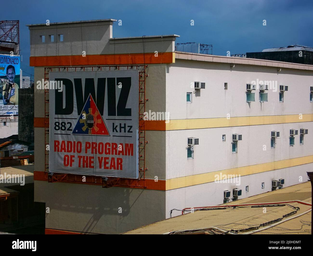 An advertising billboard for the DWIZ 882 radio station on side of ...