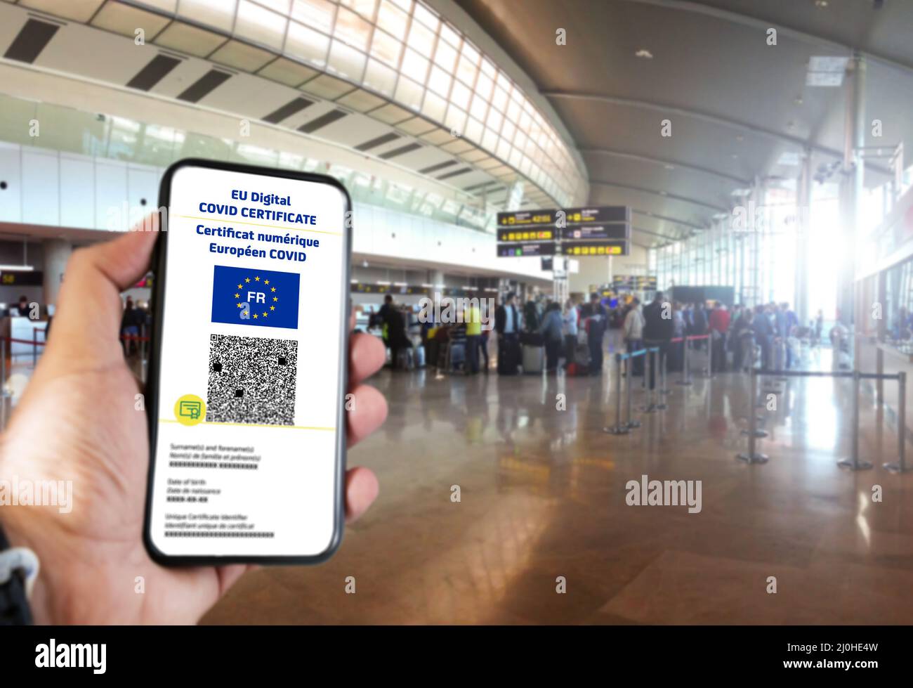 French EU Digital COVID Certificate with the QR code on the screen of a ...