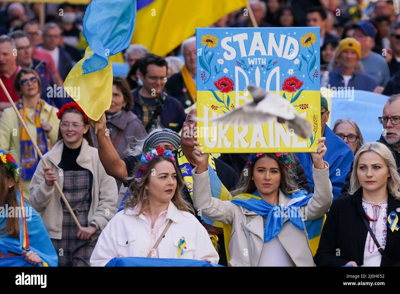 Hundreds of people take part in a solidarity march for Ukraine in ...
