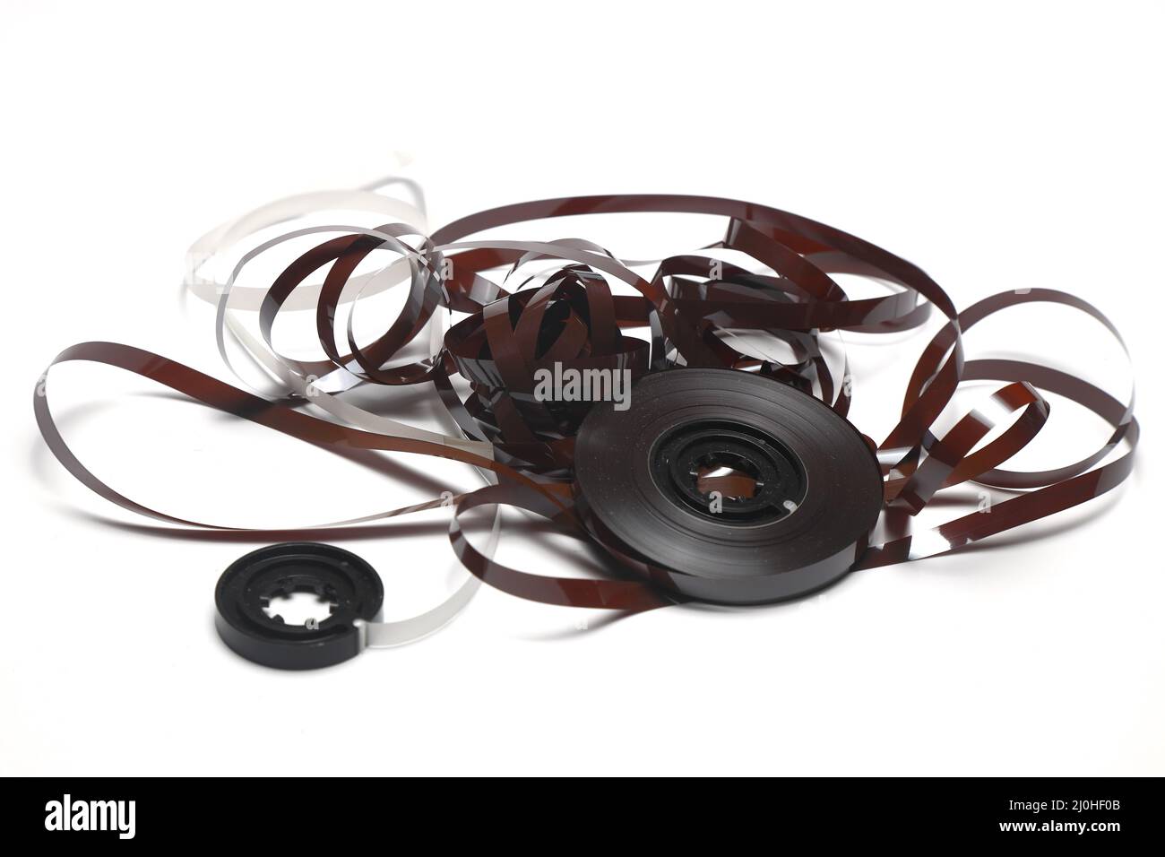 Old cassette with unwound tape. Damaged data medium for old sound ...