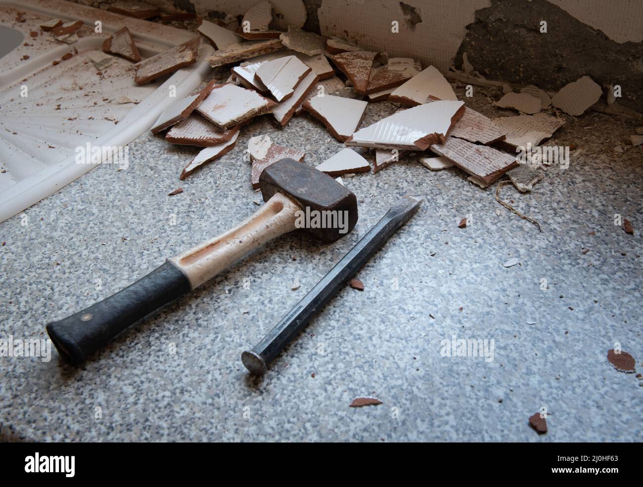 Kitchen renovation. Work Tools on a kitchen board and broken wall ...