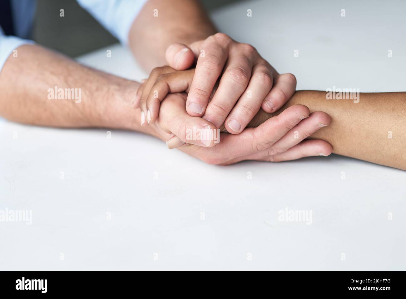 Well get through this together. Cropped shot of two people holding ...