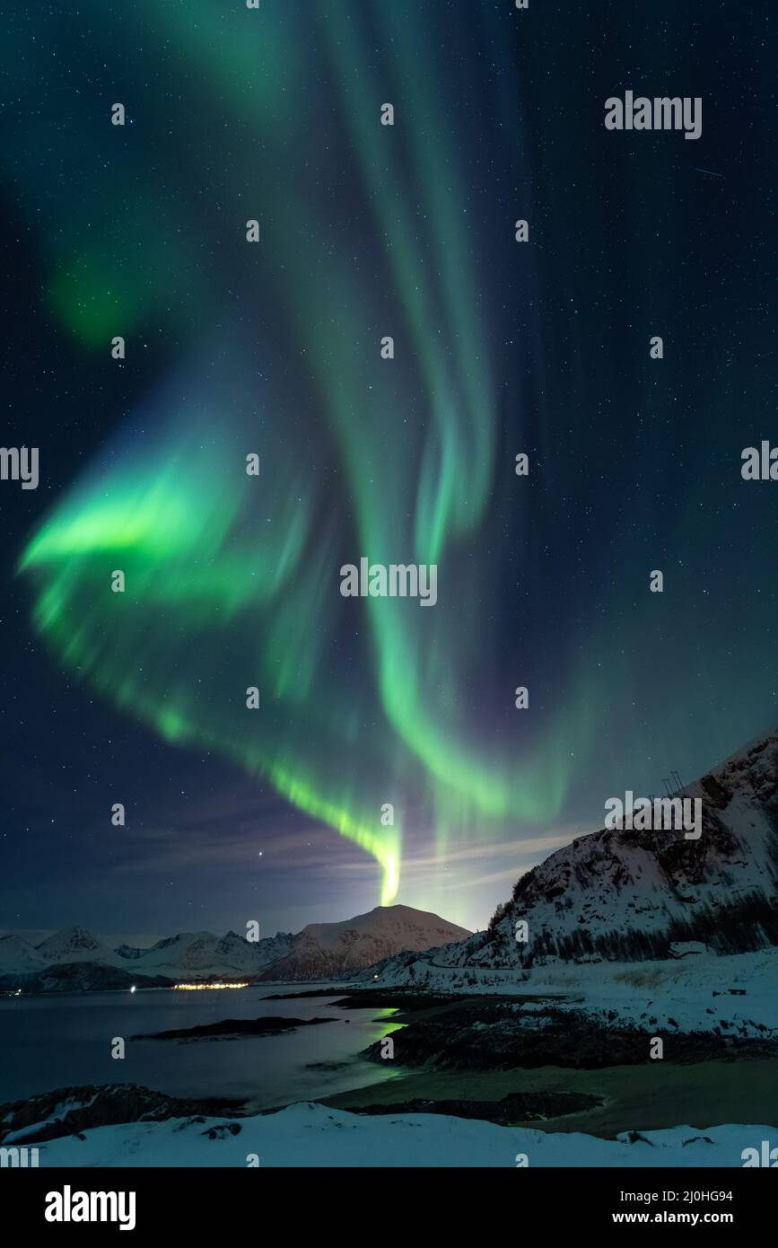 Beautiful shot of the Northern lights over the sea near Tromso, Norway ...