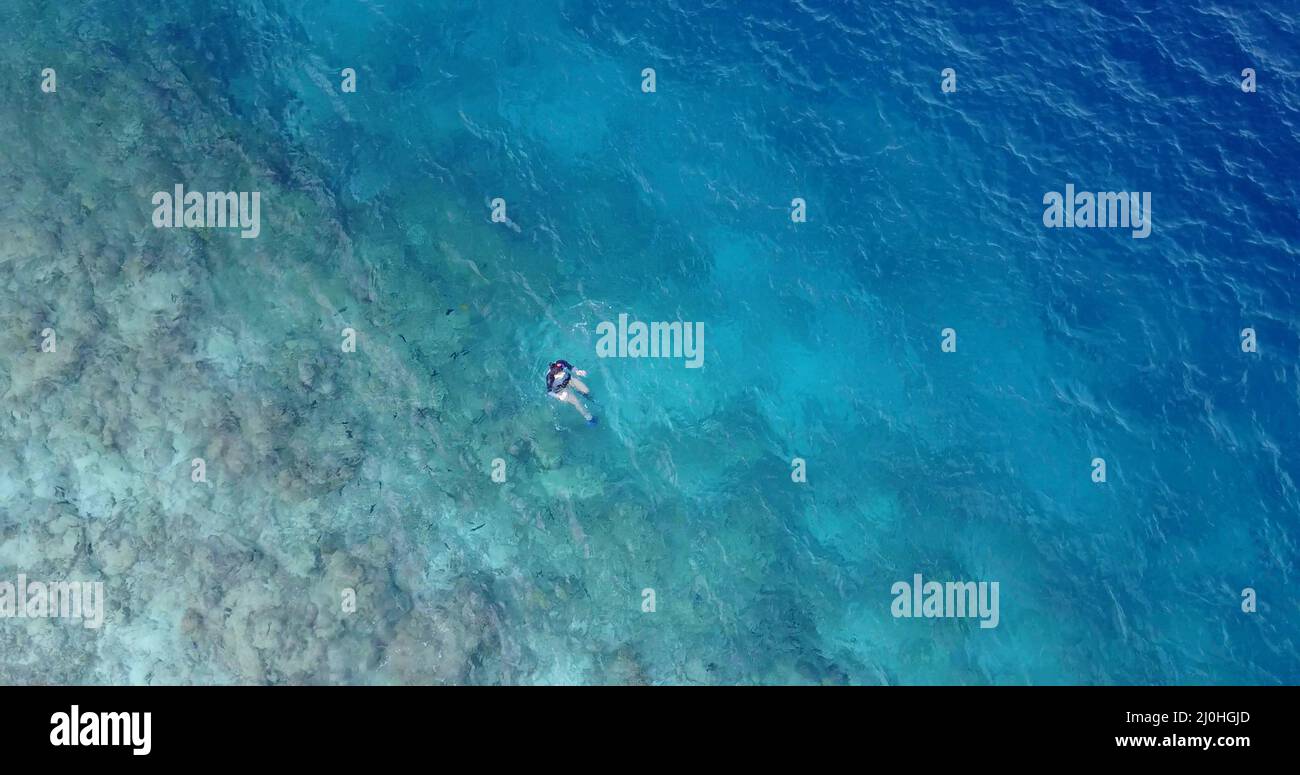 Bird's eye view of a diver in the azure water Stock Photo - Alamy