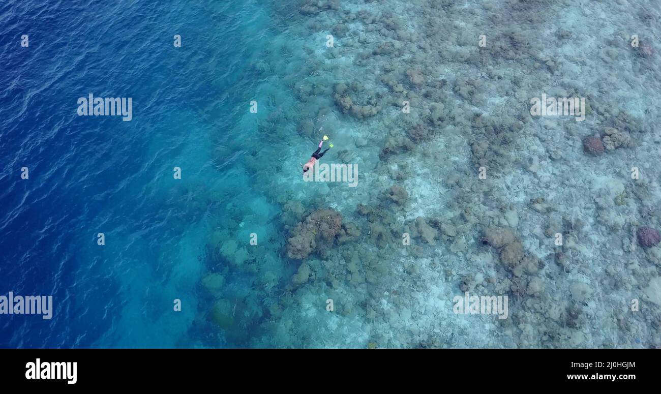 Bird's eye view of a diver in the azure water Stock Photo - Alamy