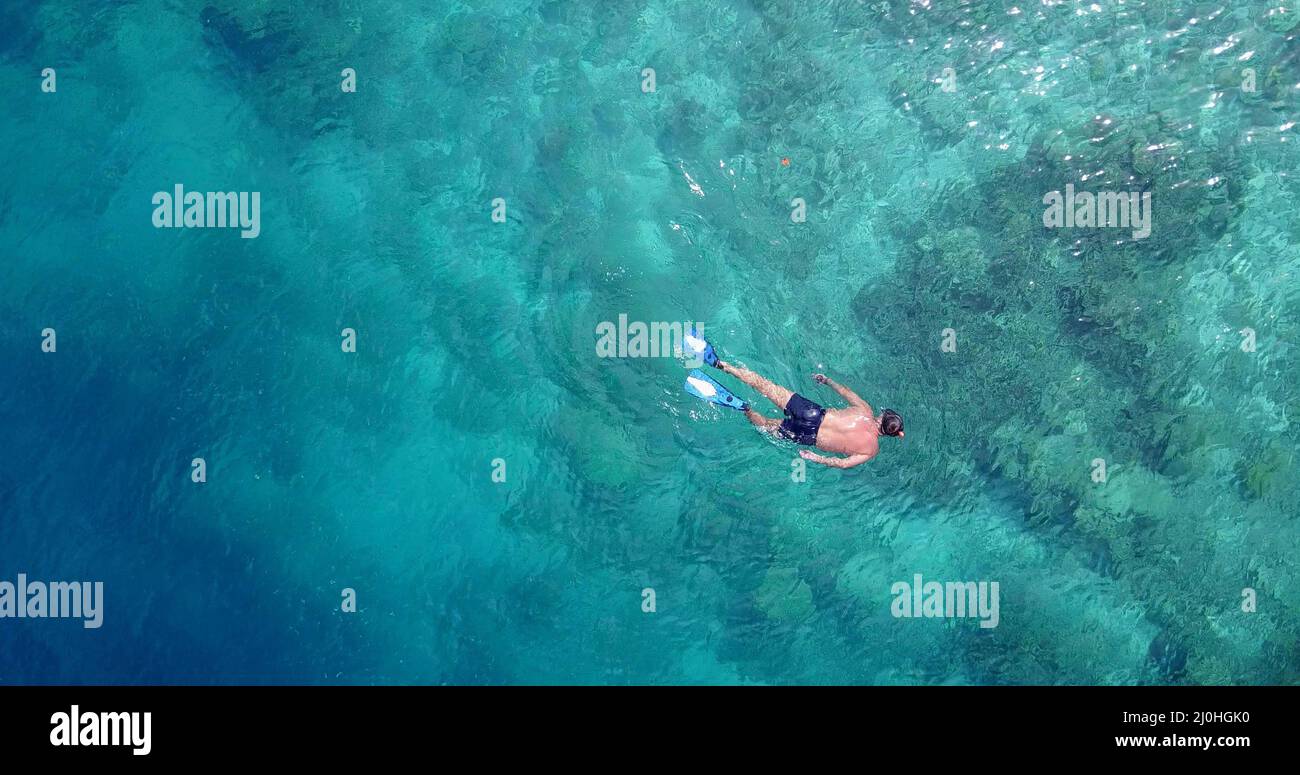 Bird's eye view of a diver in the azure water Stock Photo - Alamy