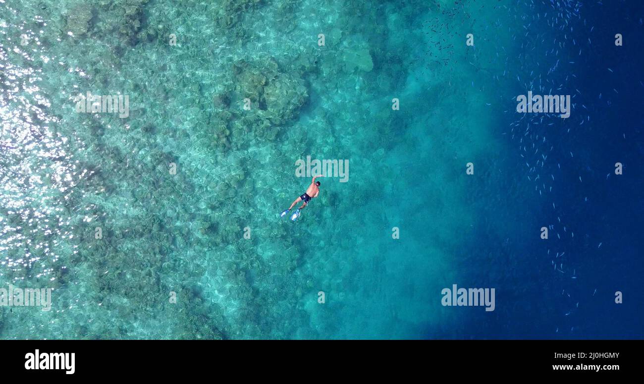 Bird's eye view of a diver in the azure water Stock Photo - Alamy