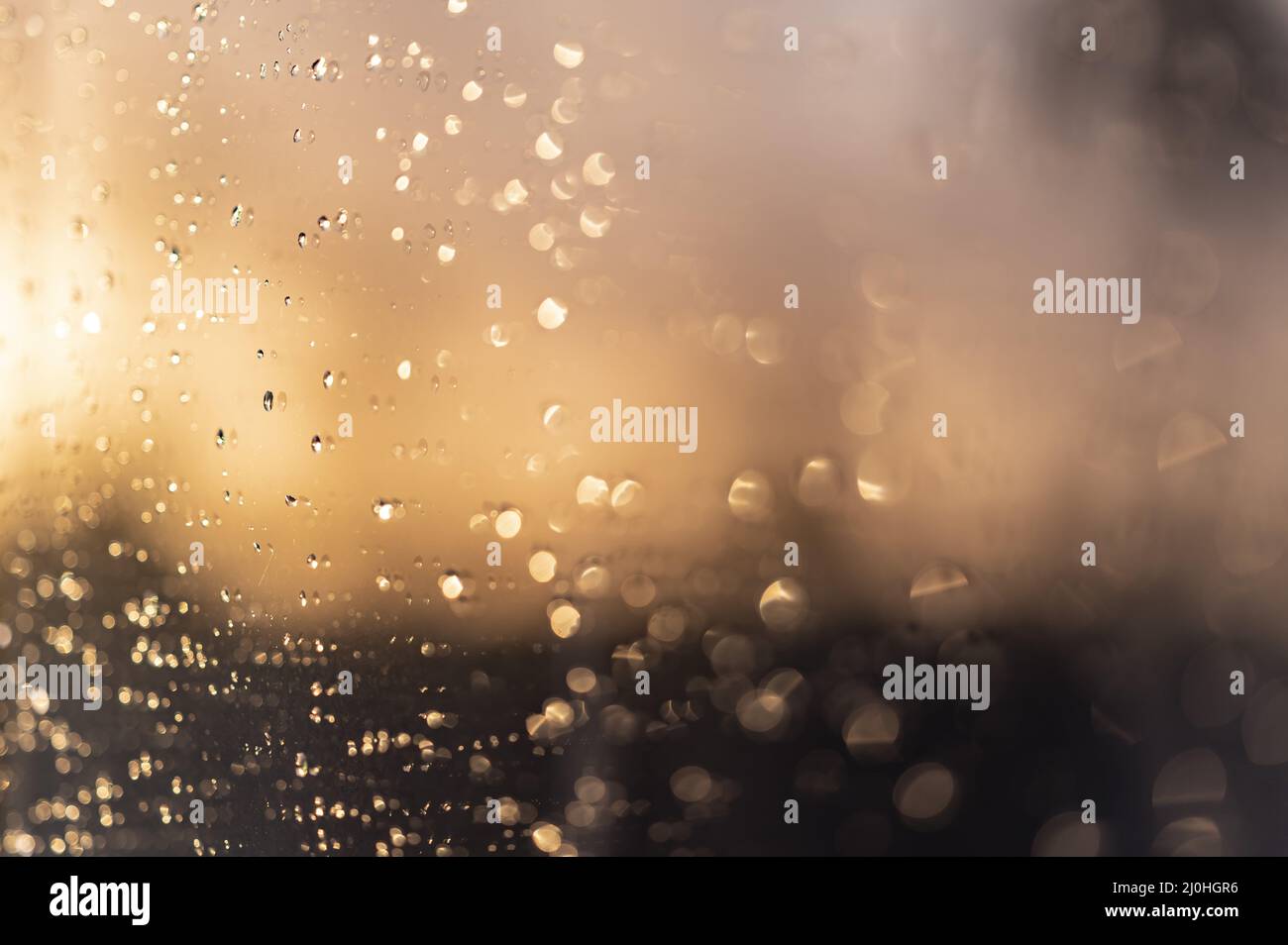 Selective focus of a transparent glass covered with waterdrops ...