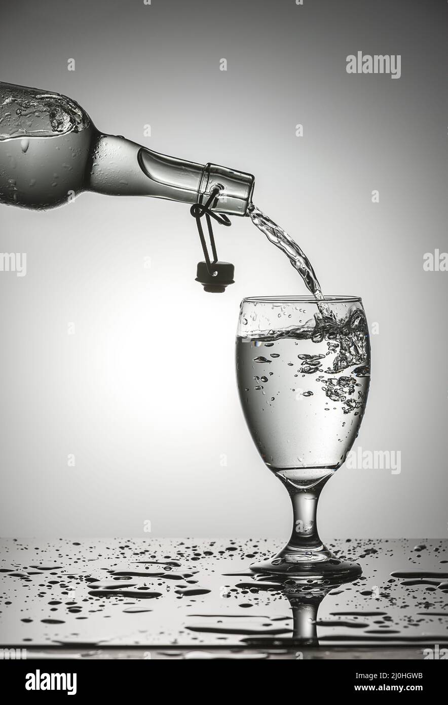 Bubbles from water being poured Stock Photo - Alamy