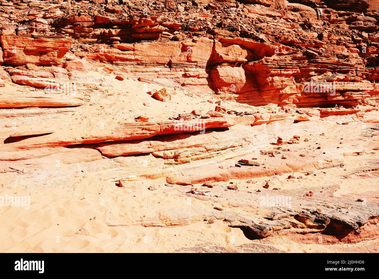 The red sand rocks in desert. Vertical shot Stock Photo - Alamy
