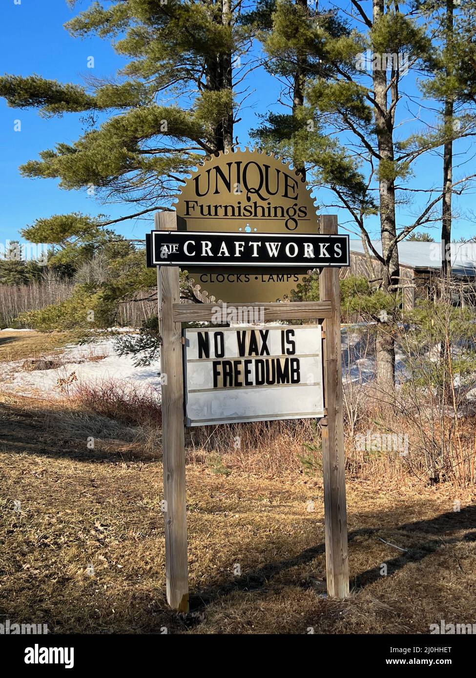 A sign reads No VAX IS FREEDUMB at Ajf Craftworks in Belgrade, Maine on ...