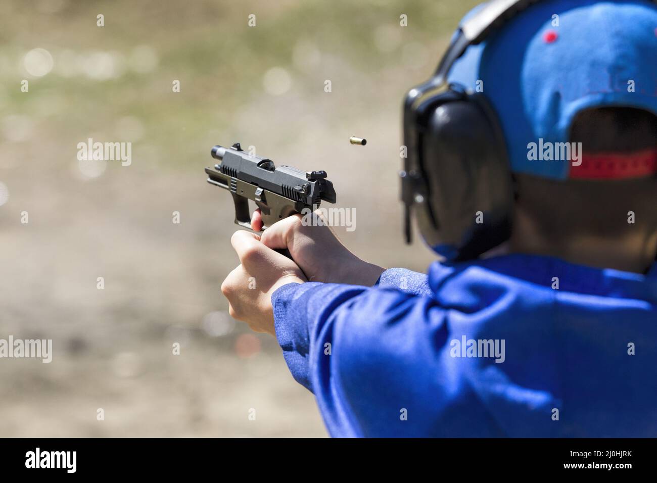 Boy learning to shoot hi-res stock photography and images - Alamy