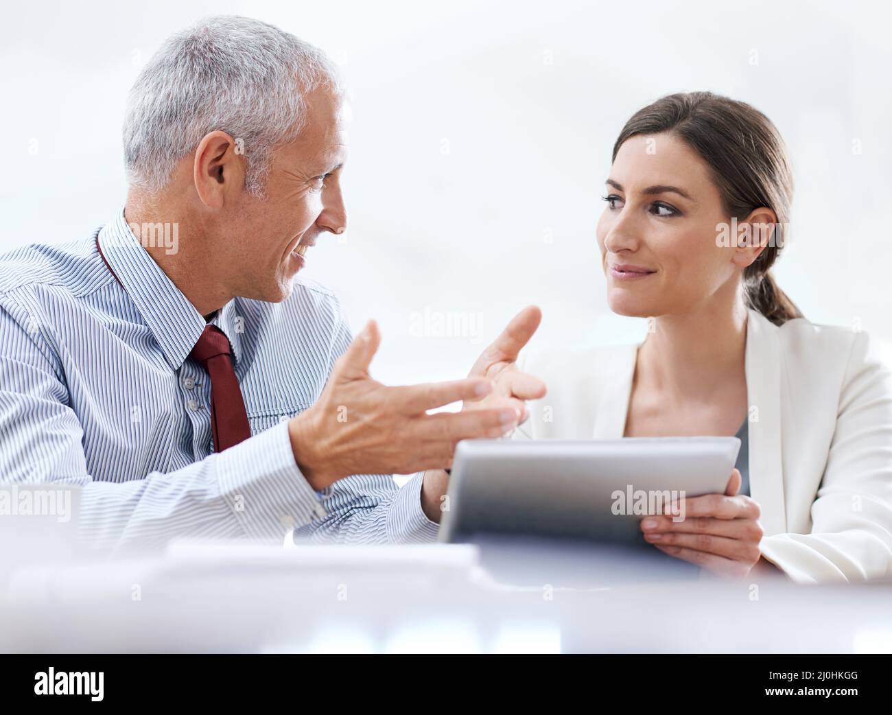 Technology supporting business processes. Cropped shot of two coworkers ...