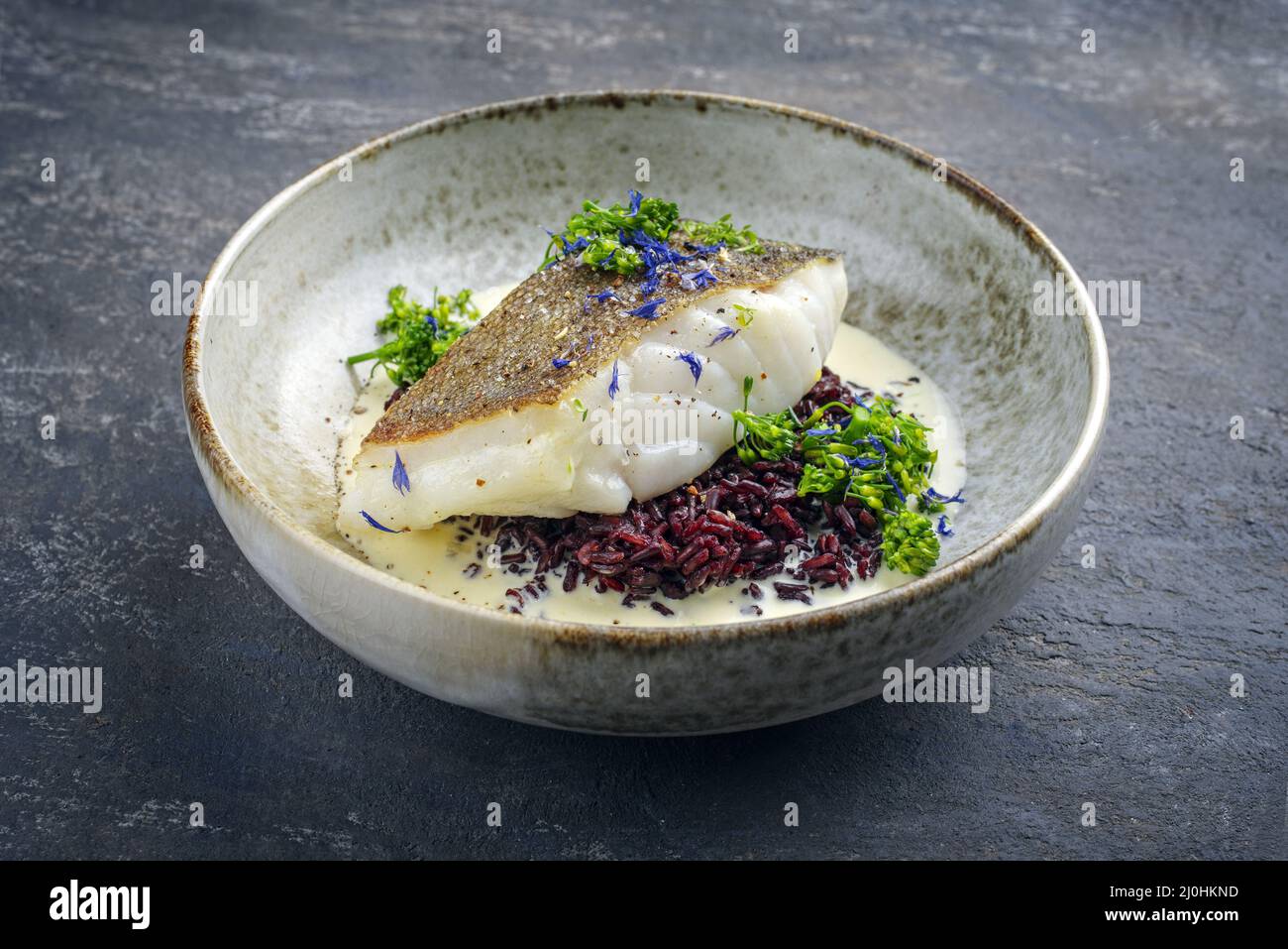 Modern style traditional fried skrei cod fish filet with baby broccoli ...