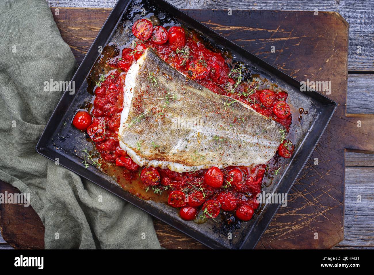 Traditional skinned backed skrei cod fish filet with tomato salsa ragu ...