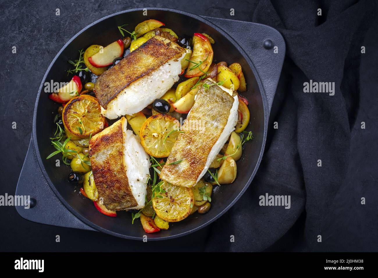 Modern style traditional fried skrei cod fish filet with fried potato ...