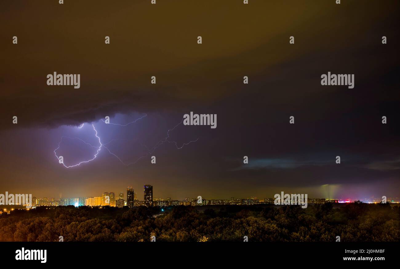 Summer bolt of lightning striking in night moscow city Stock Photo - Alamy
