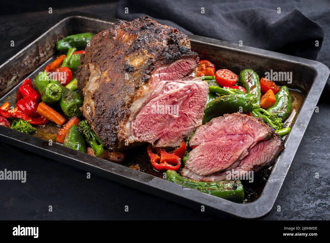 Traditional English barbecue lamb roast with vegetable and gravy sauce ...