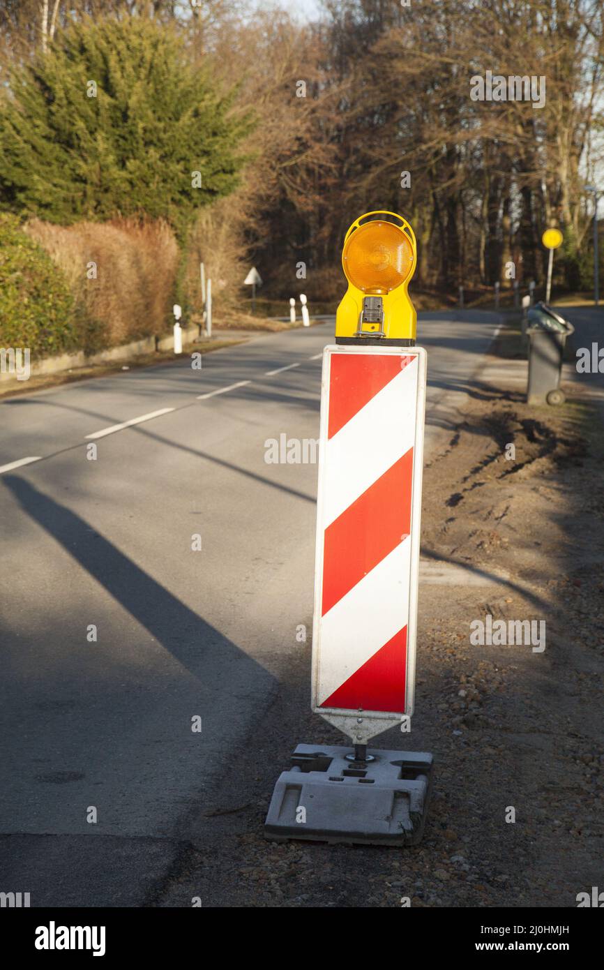 Vertical shot of a warning light on the road Stock Photo - Alamy