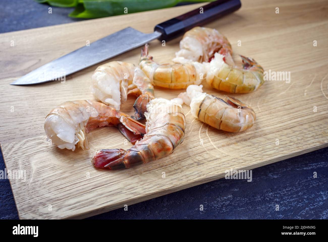 Traditional cooked black tiger prawn without head offered as top view ...