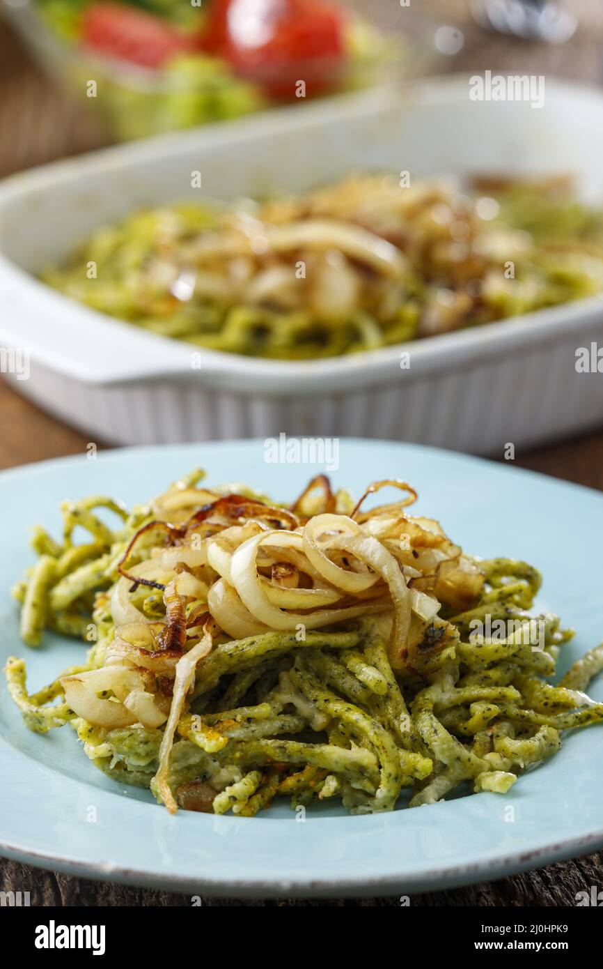 Bavarian spinach spaetzle pasta on wood Stock Photo - Alamy