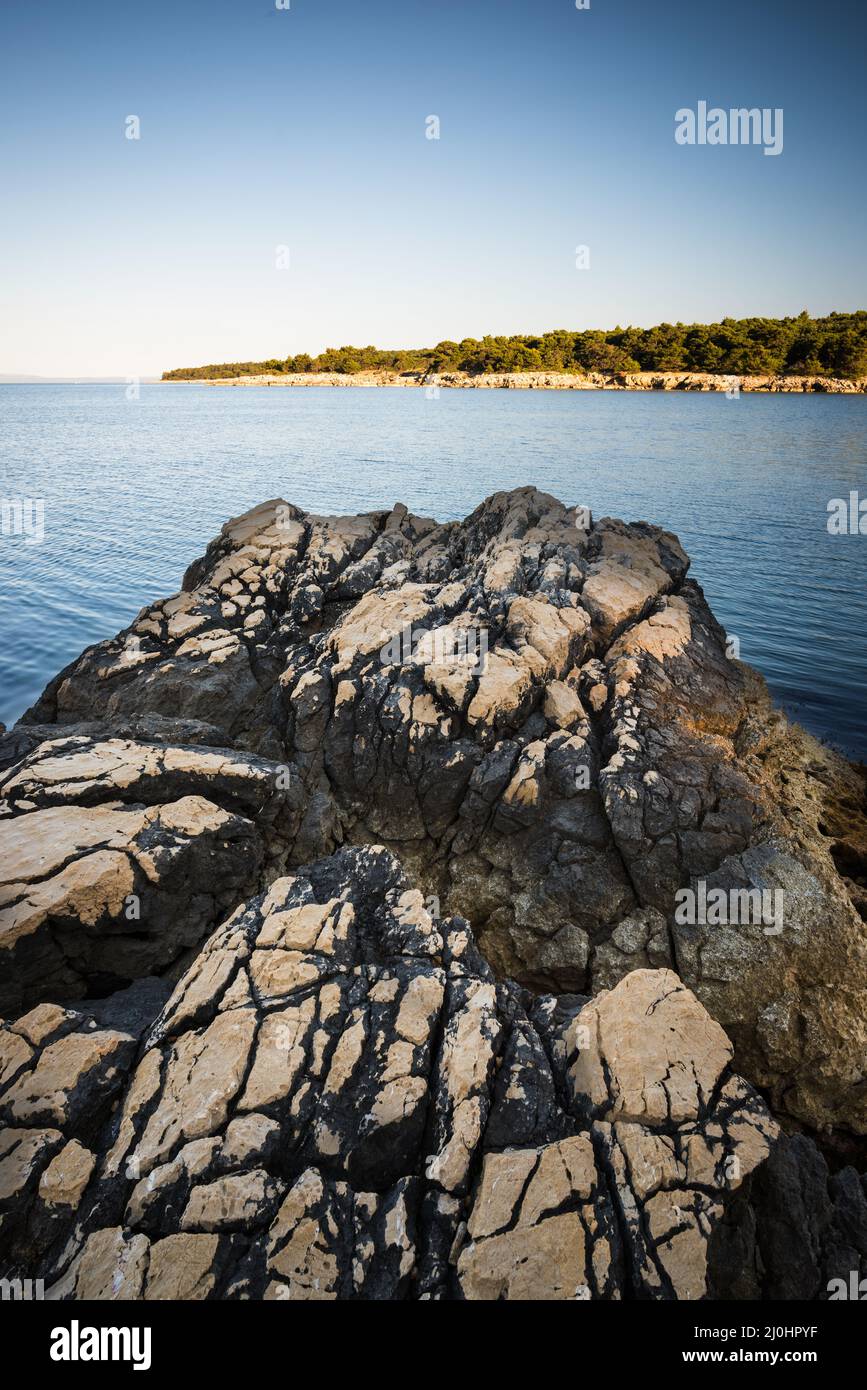 Massive Rock with colour structure on the coastline of the island of ...