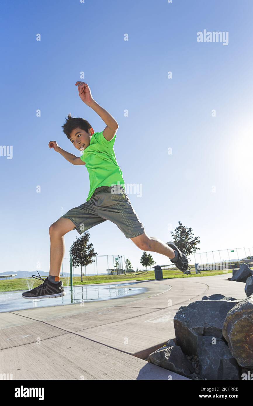 Leaping child hi-res stock photography and images - Alamy