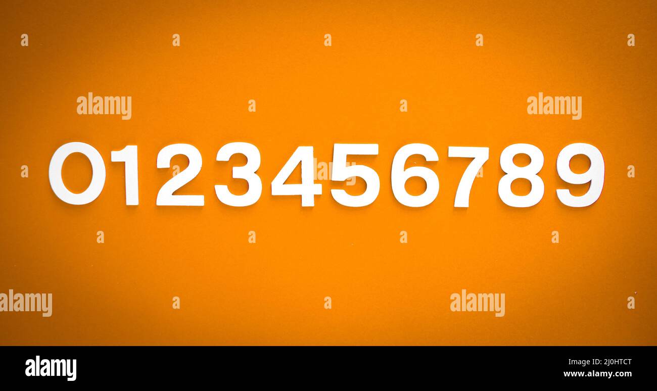 Mathematics background made with solid numbers. Isolated on orange ...