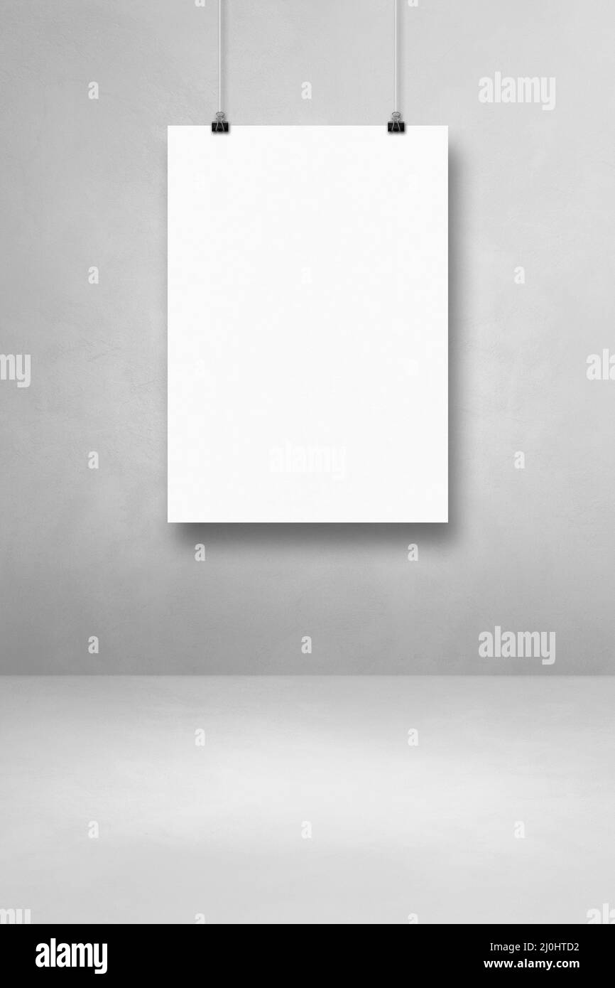 White poster hanging on a light concrete wall with clips Stock Photo ...