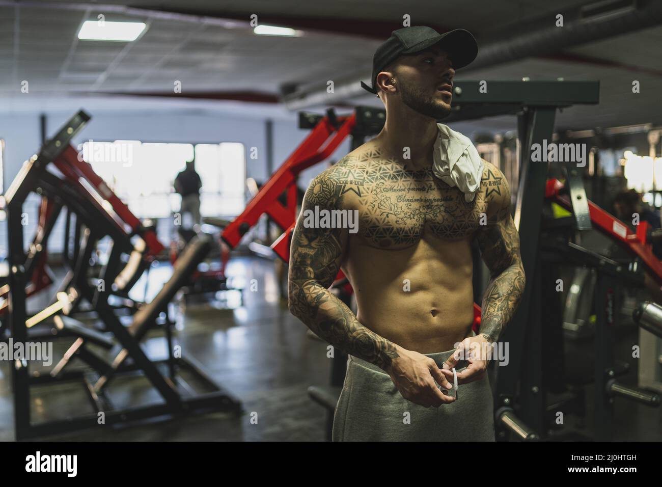 Handsome man doing a workout in the gym Stock Photo - Alamy