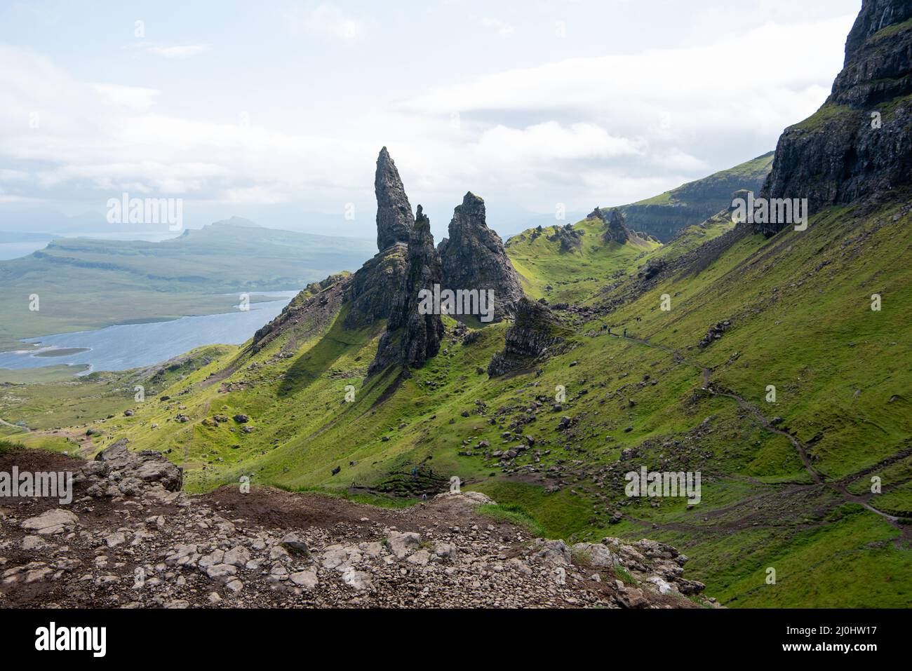 Aerial view of sharp stone formations on a mountainside near a lake in ...
