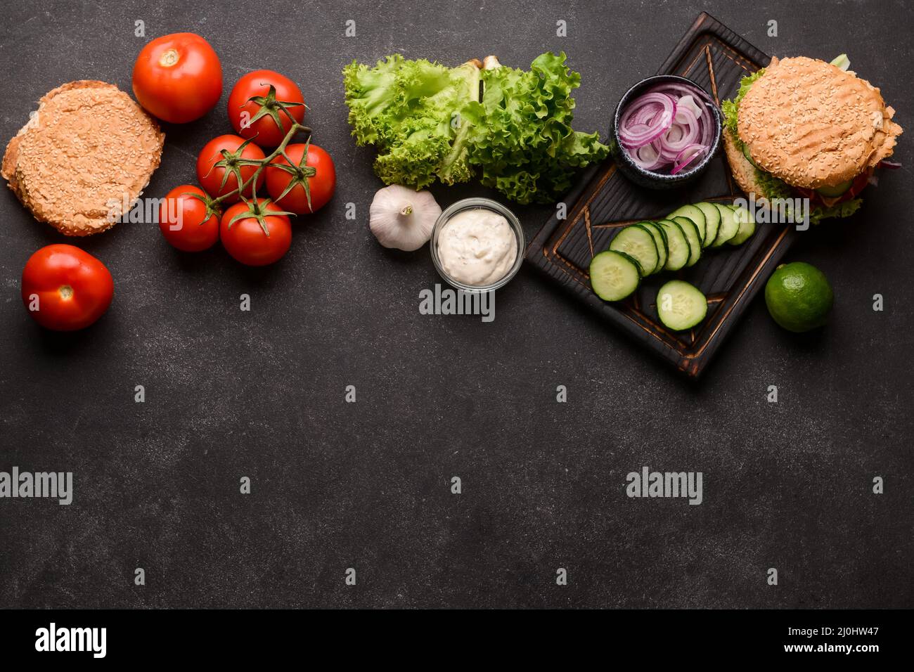 Fresh doner kebab in bun and ingredients on dark background Stock Photo ...