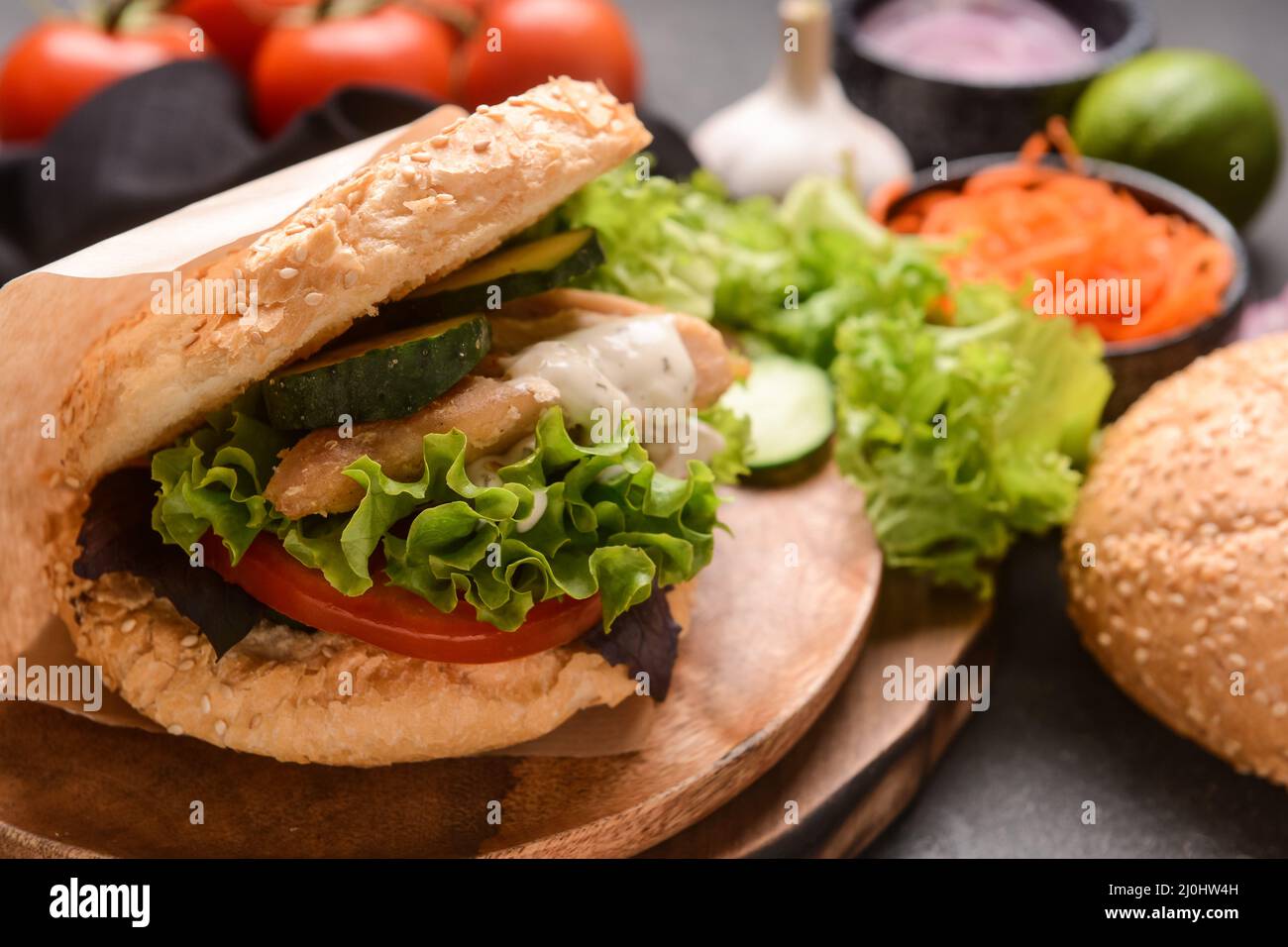 Fresh doner kebab in bun on dark background Stock Photo - Alamy