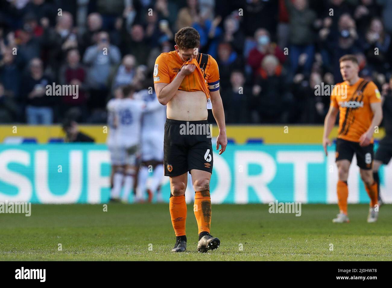 Richard Smallwood #6 of Hull City wipes his face with his shirt as ...