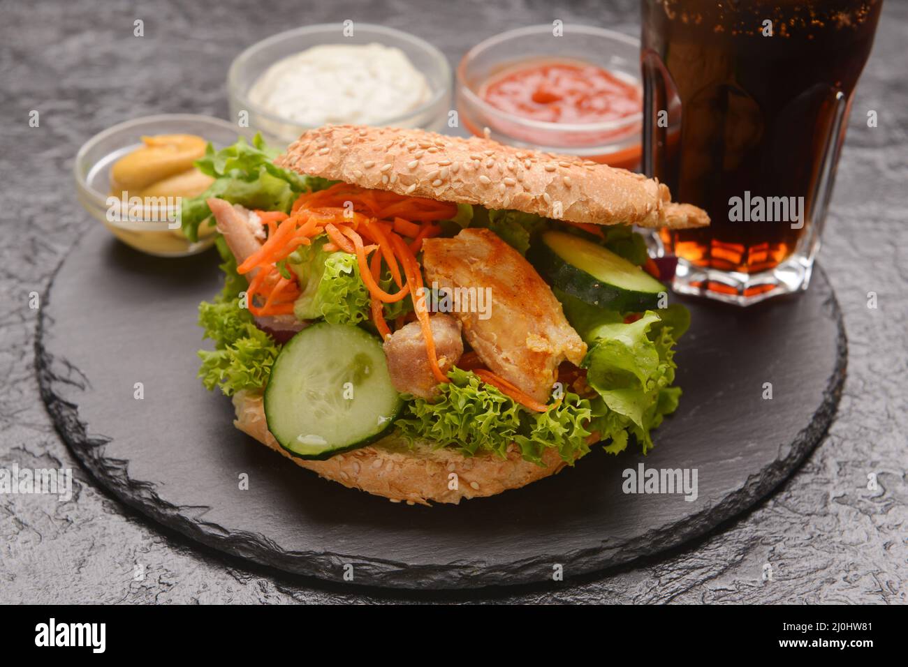 Fresh doner kebab in bun on dark background Stock Photo - Alamy