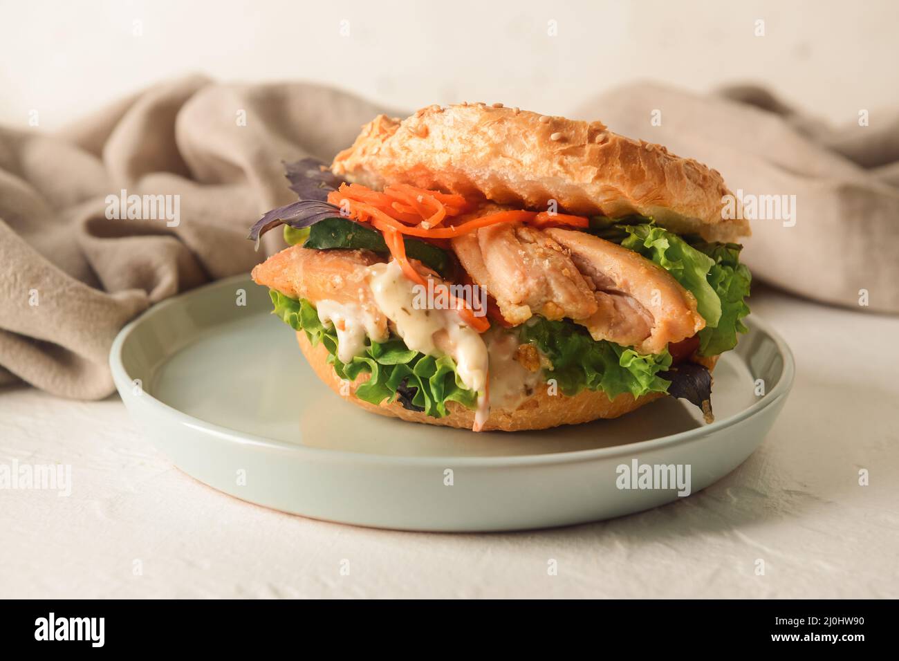 Plate with fresh doner kebab in bun on white background Stock Photo - Alamy