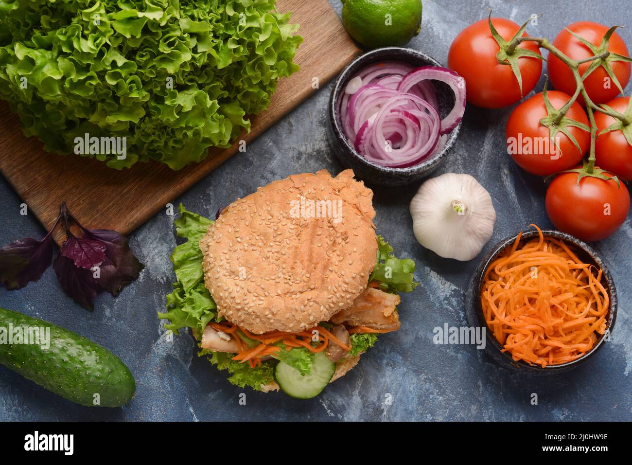 Fresh doner kebab in bun and ingredients on color background Stock ...